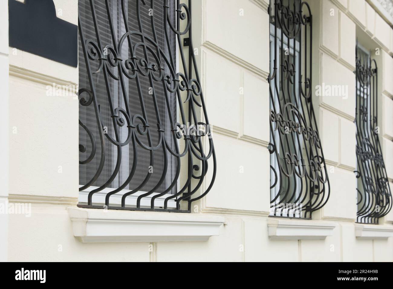Beautiful windows with grills in building outdoors Stock Photo - Alamy