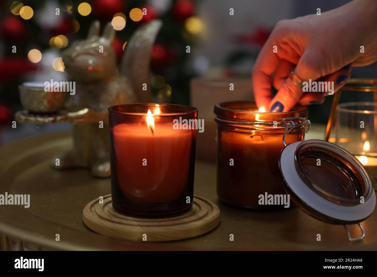 Person lighting candle in bokeh hi-res stock photography and images - Alamy