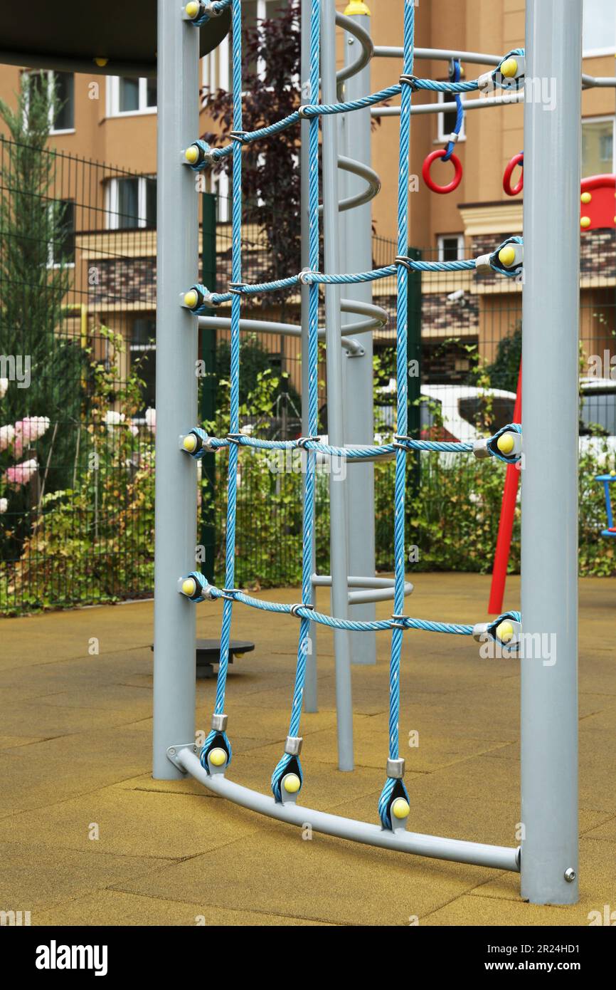 Net climbing wall on outdoor playground in residential area Stock Photo ...