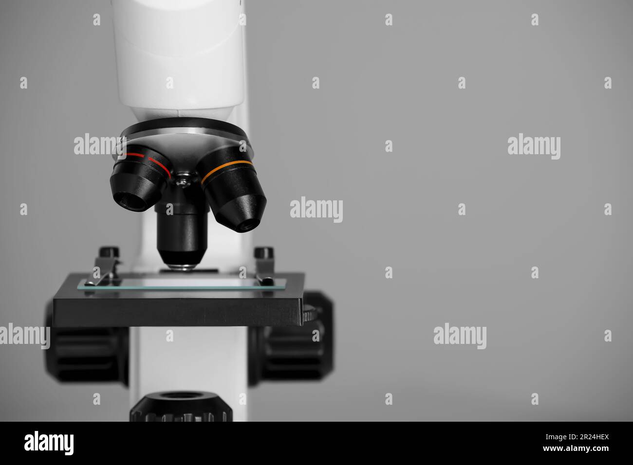 Modern microscope on grey background, closeup. Space for text Stock ...