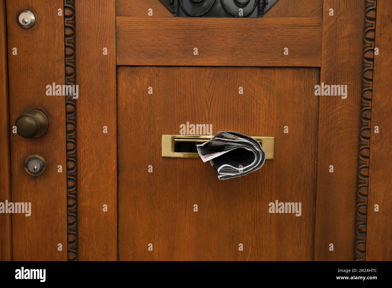Newspaper in letterbox hi-res stock photography and images - Alamy