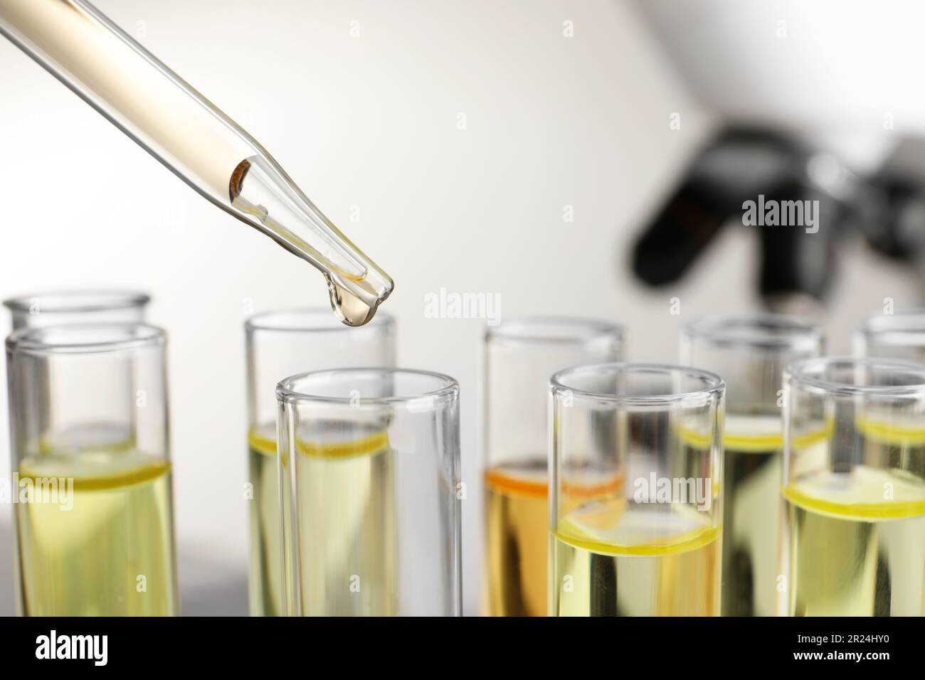 Dropping urine sample for analysis into tube, closeup Stock Photo - Alamy