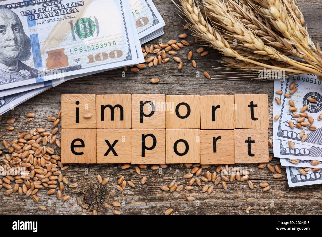 Words Import and Export made of cubes, wheat and banknotes on wooden ...