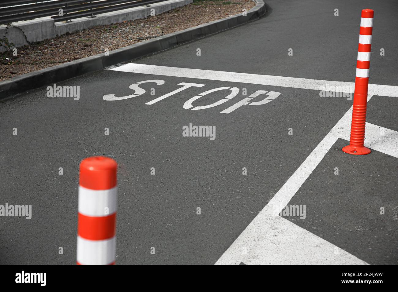 White painted stop marking on asphalt outdoors Stock Photo - Alamy