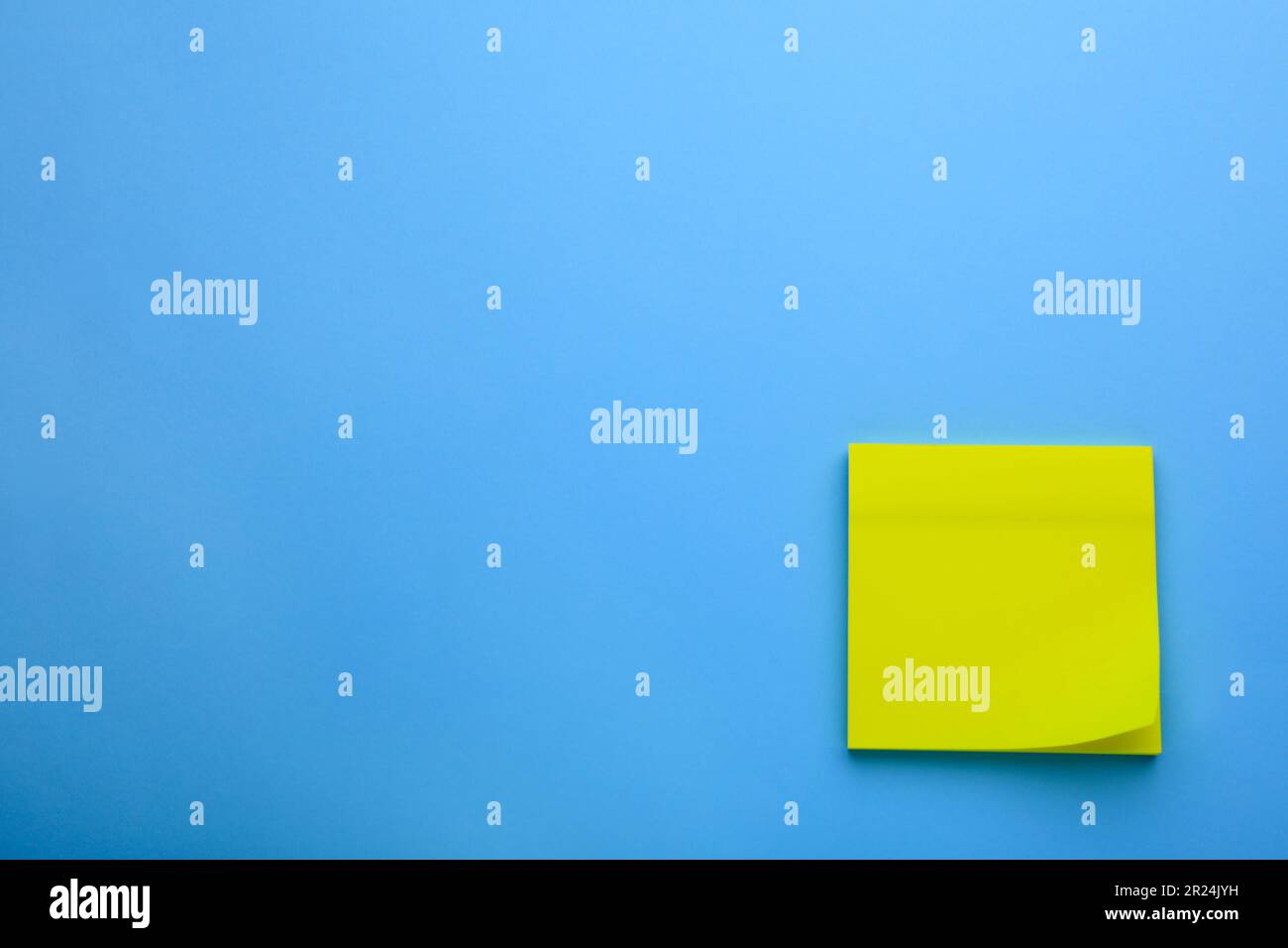Paper note on light blue background, top view. Space for text Stock ...