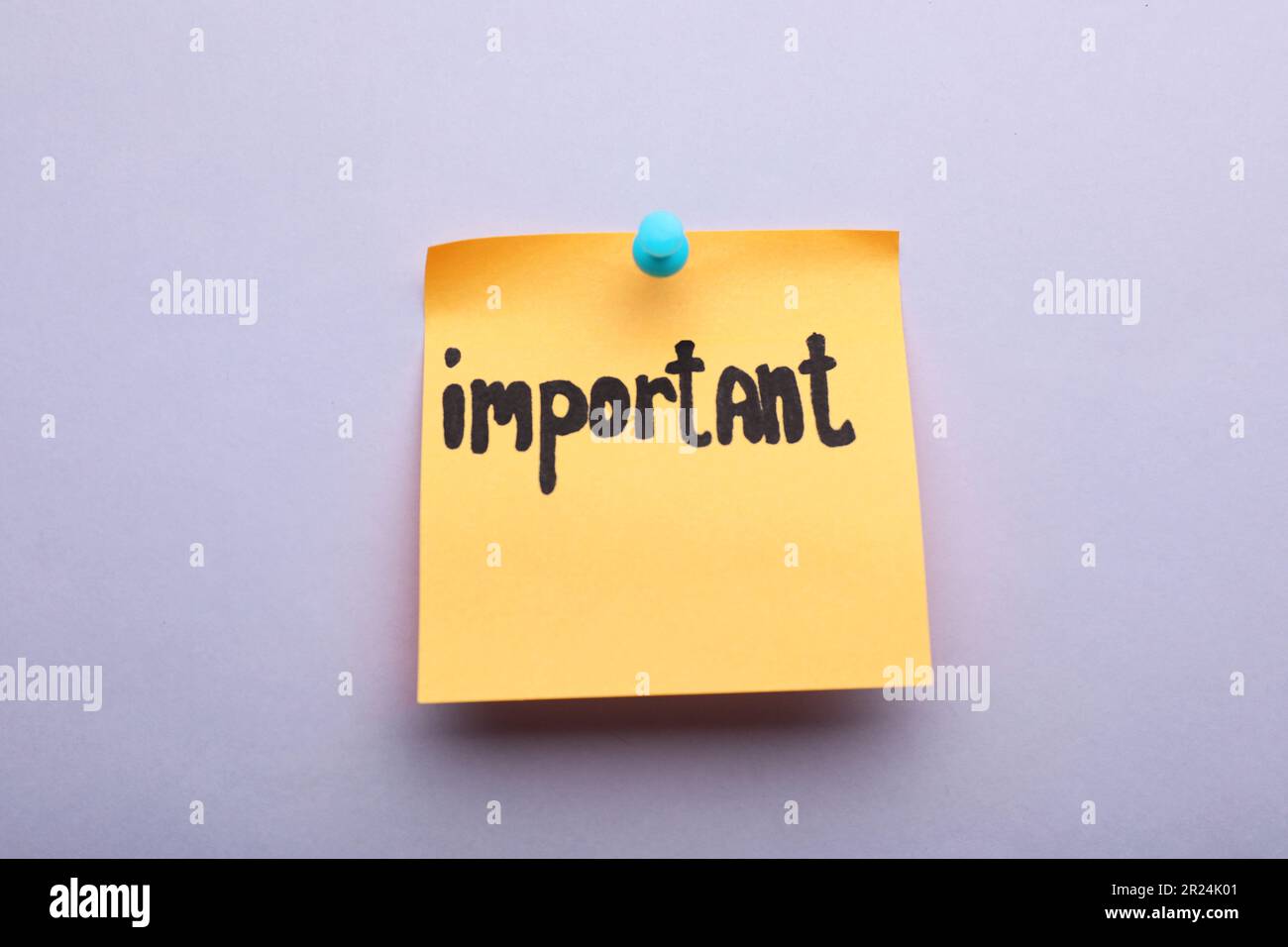 Paper note with word Important pinned on light grey background Stock ...