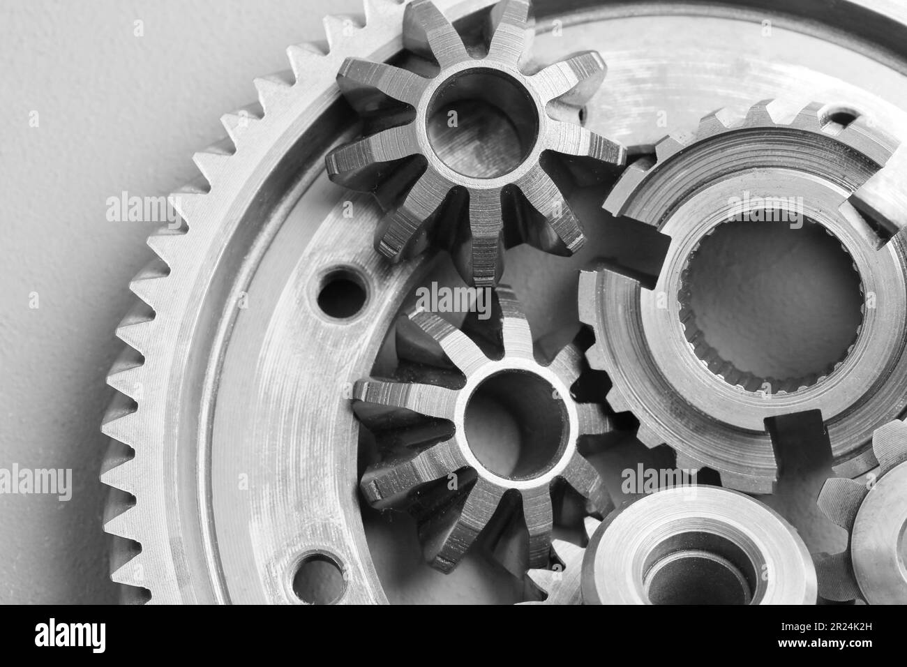 Different stainless steel gears on light grey background, top view ...