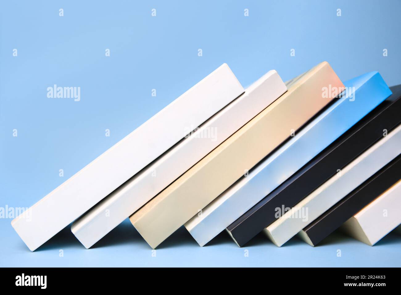 Collection of books on light blue background Stock Photo - Alamy