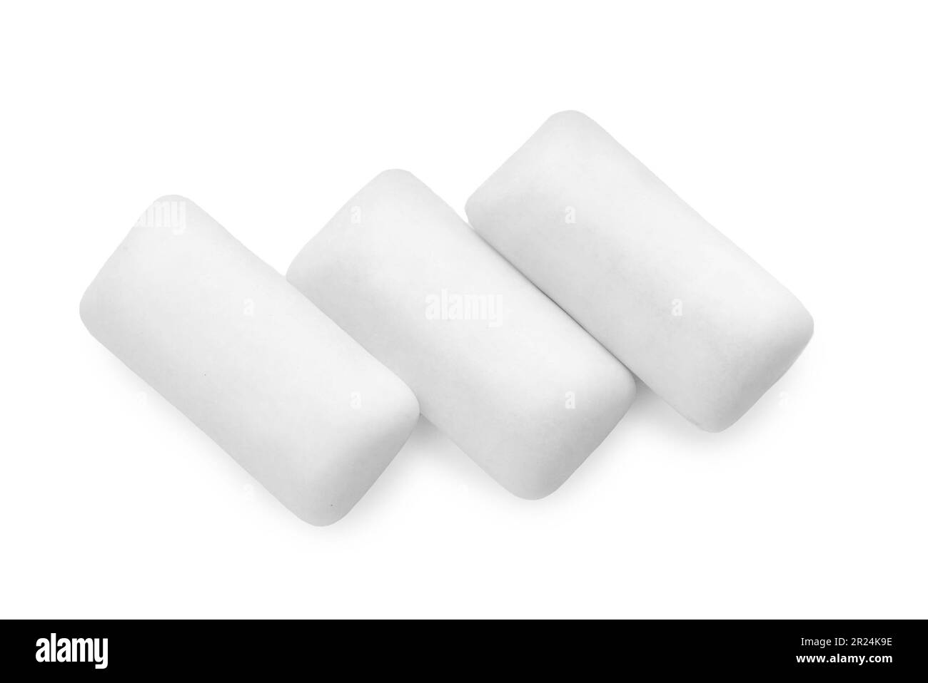 Three pieces of chewing gum on white background, top view Stock Photo ...