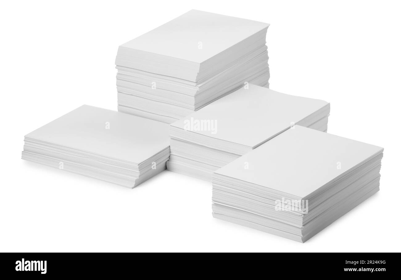 Stacks of paper sheets on white background Stock Photo - Alamy