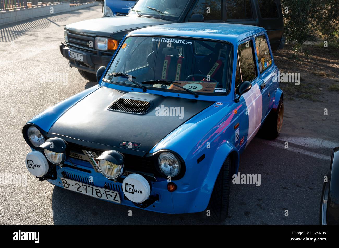 Detail of a small typical sports car in Spain, it is a blue Autobianchi A112 Abarth rally parked ...