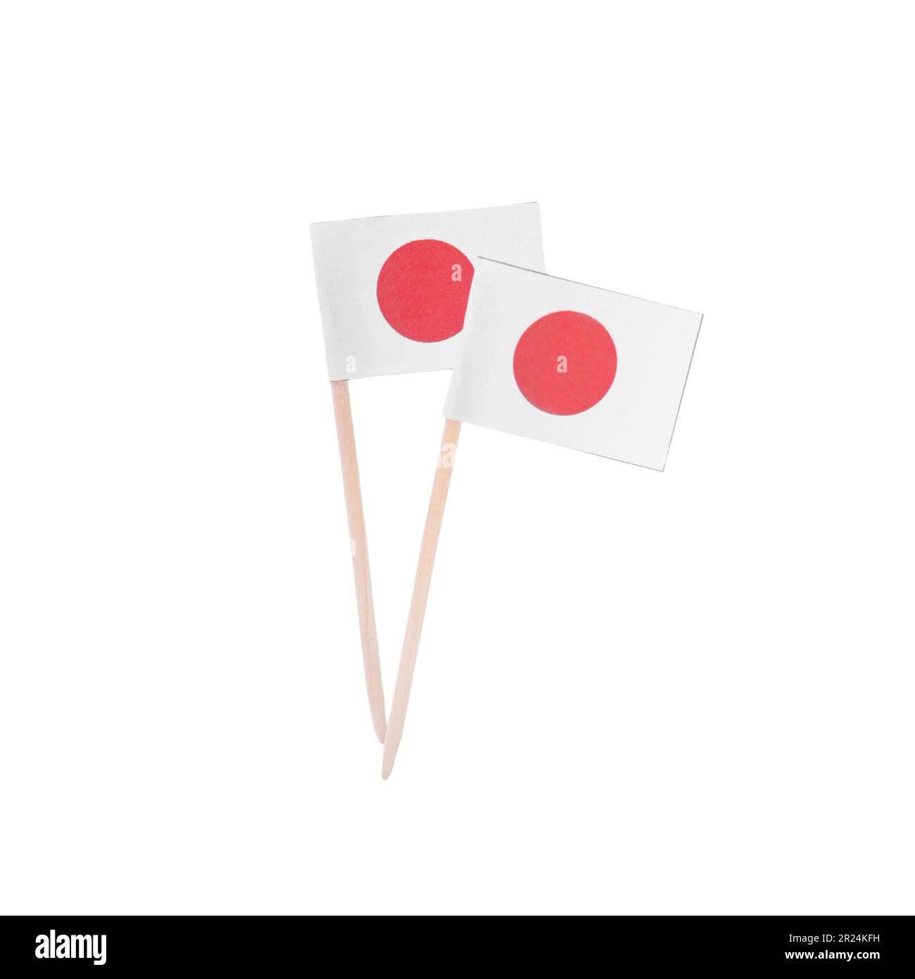 Small paper flags of Japan on white background Stock Photo - Alamy