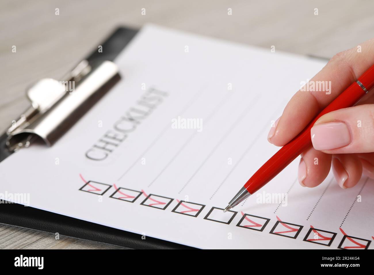 Woman filling checklist table hi-res stock photography and images - Alamy