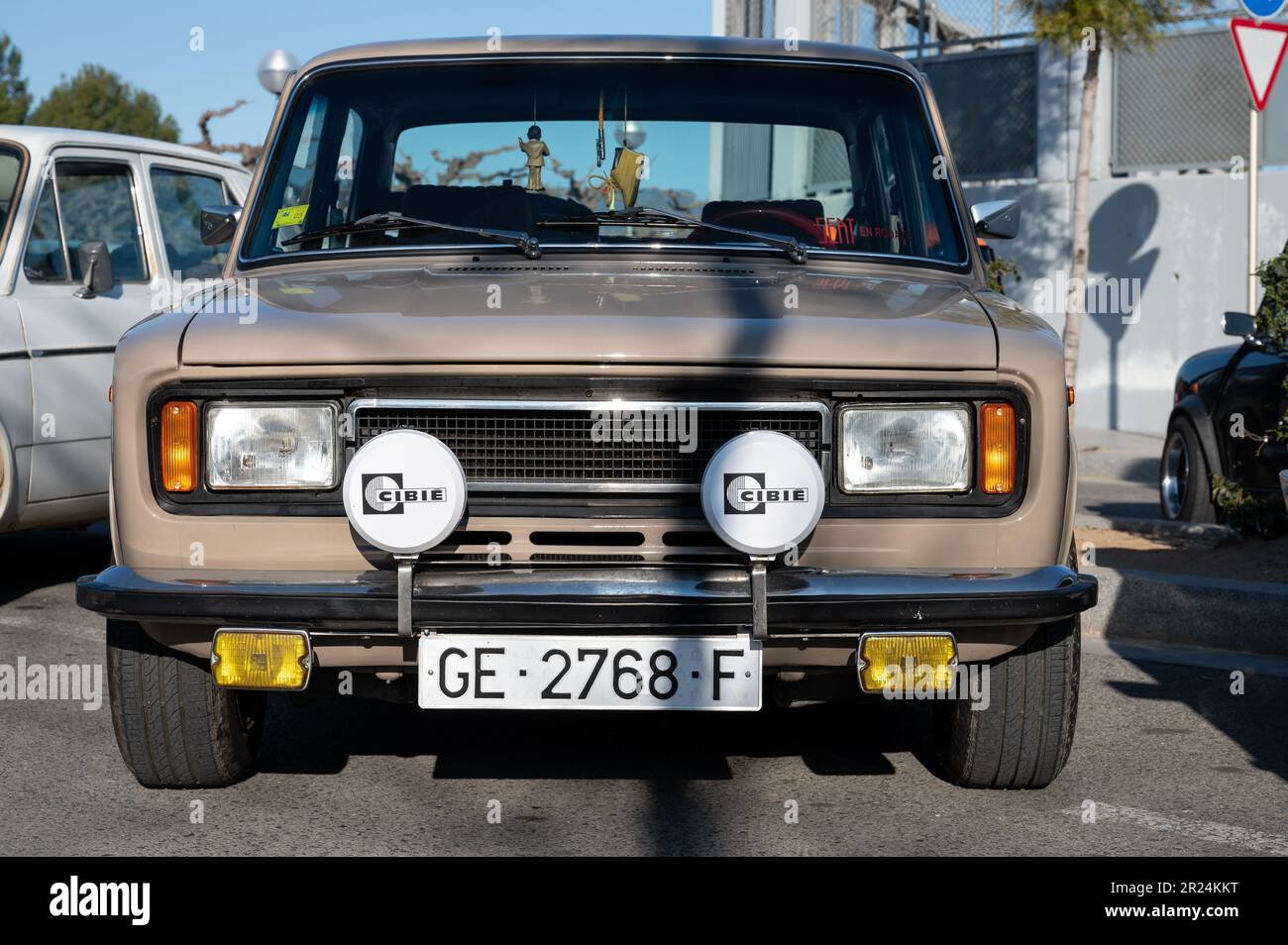 Detail of a classic and typical Spanish car, the Seat 124 in earth ...