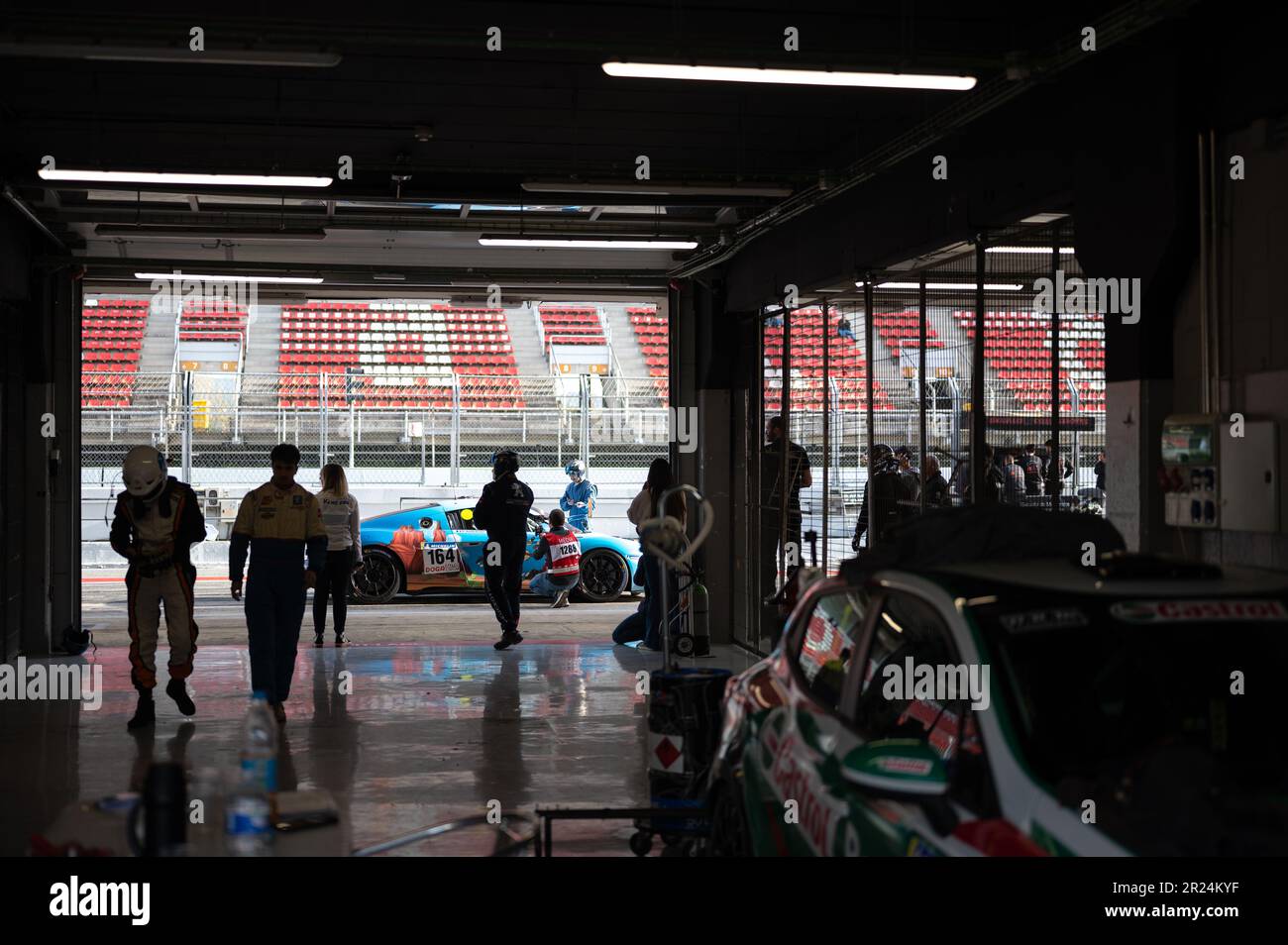 Detail of an endurance racing Audi R8 GT4 in the pit lane, seen through ...