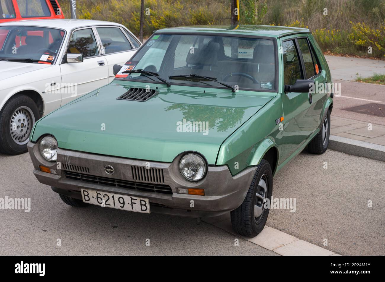 Detail of an old Spanish car, the Seat Ritmo 65 in lime green Stock ...