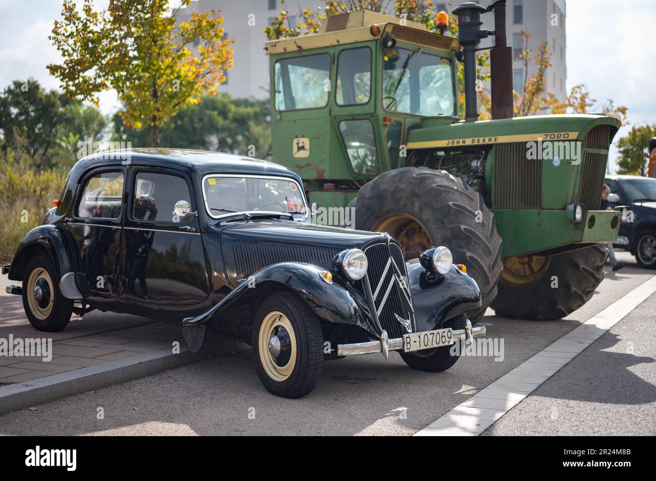 Front view of a black French historical vehicle parked next to a ...