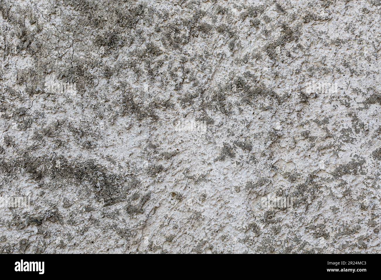 Rough textures on a white wall, the surface is uneven. Texturized ...
