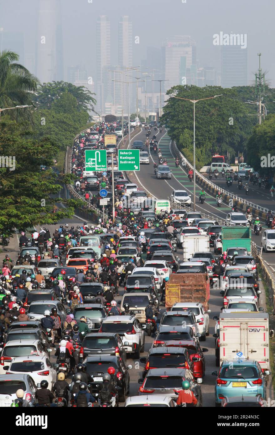 Jakarta, Indonesia-May 14, 2023: Busy traffic with chaotic vehicles scrambling on the highway ...