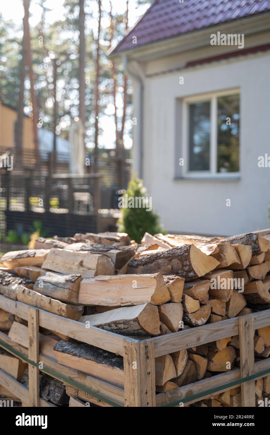Pallet with firewood on private backyard with house on background Stock ...