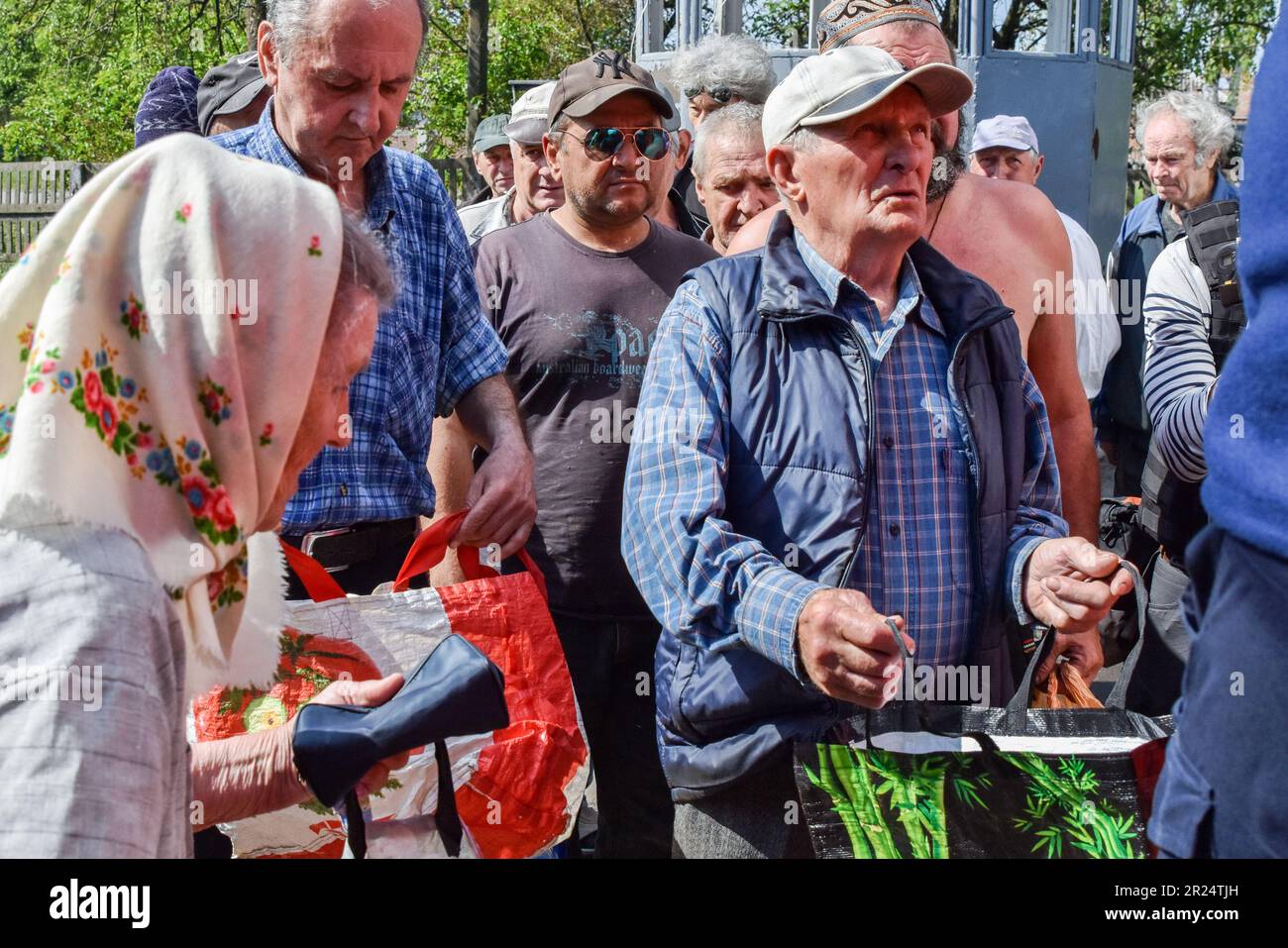 Orikhiv, Ukraine. 16th May, 2023. People wait in line to receive bread ...