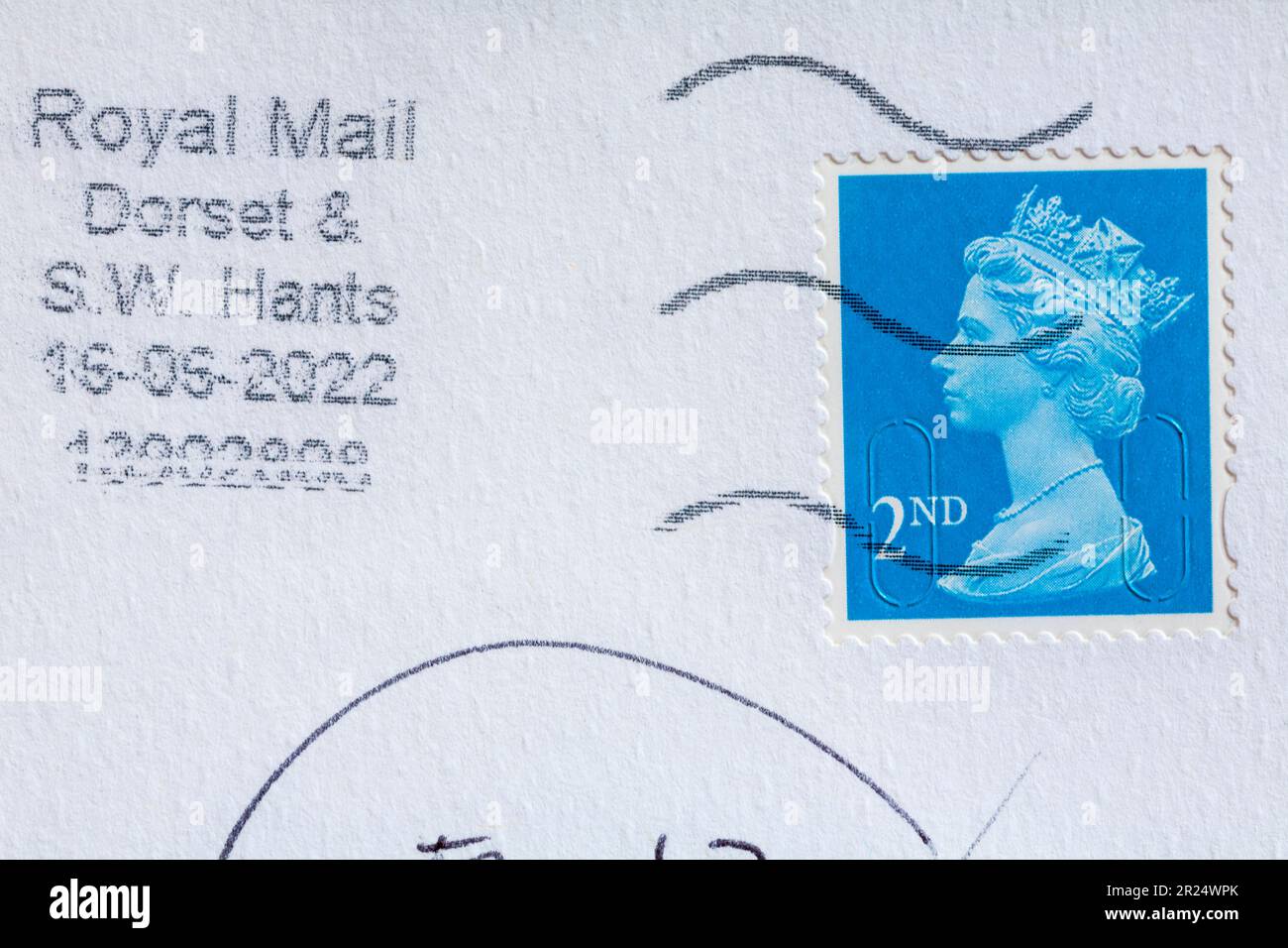 2nd class postage stamp with Queens head on envelope with Royal Mail ...