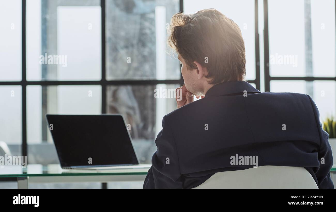 Rear back view portrait businessman sitting at desk at workplace Stock ...