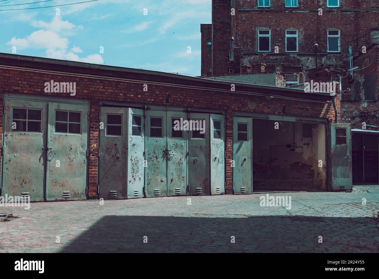 old garage buildings with metal doors Stock Photo - Alamy
