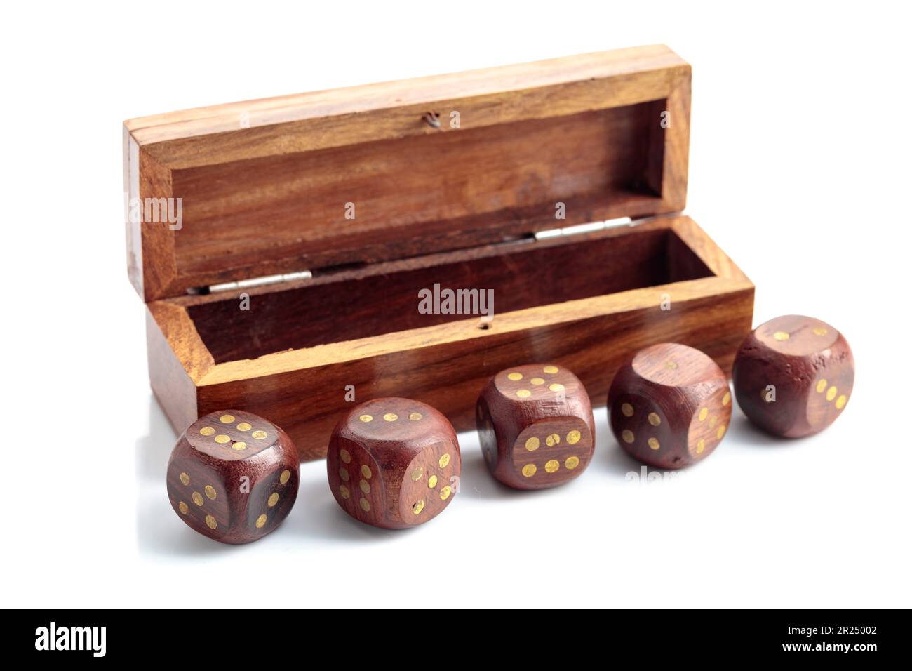 The old wooden dice with the box is isolated on a white background ...