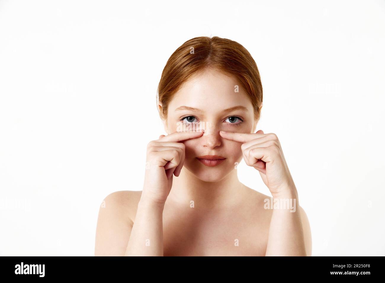 Portrait of tender, beautiful, young redhead girl touching nose against ...