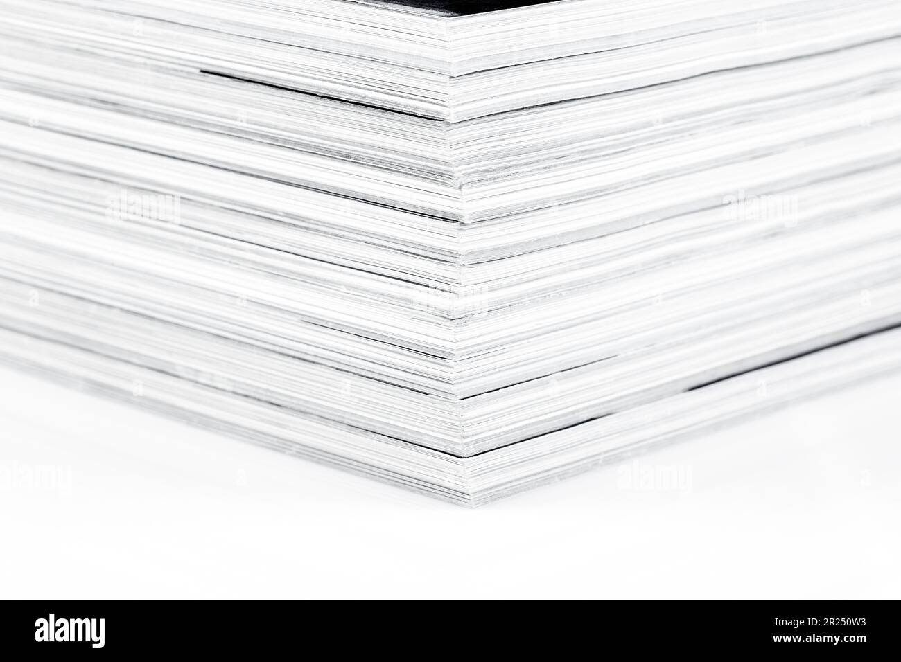 A stack of magazines isolated on a white background Stock Photo - Alamy