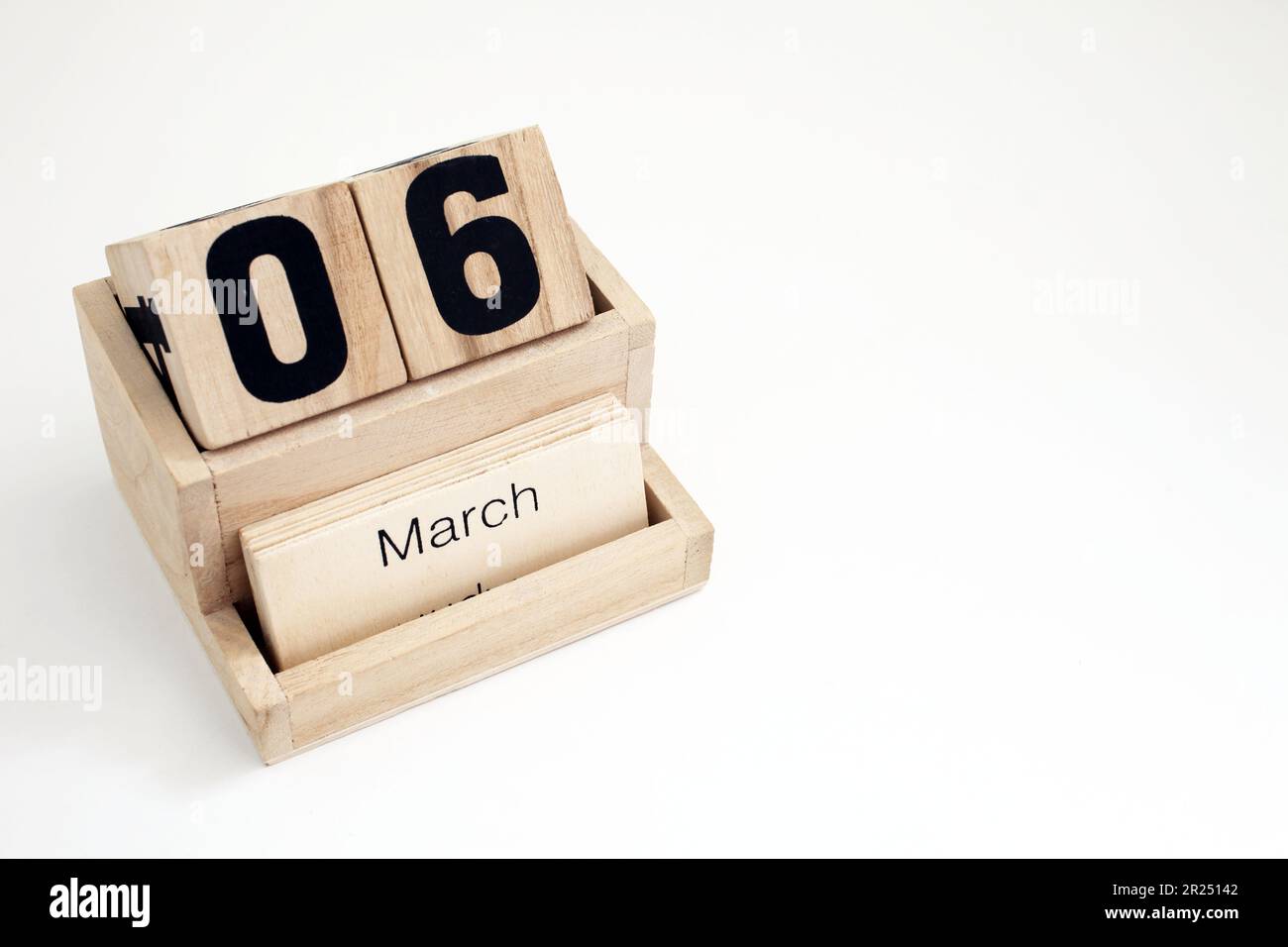 Wooden perpetual calendar showing the 6th of March Stock Photo - Alamy