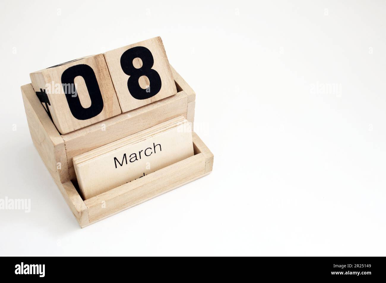 Wooden perpetual calendar showing the 8th of March Stock Photo - Alamy