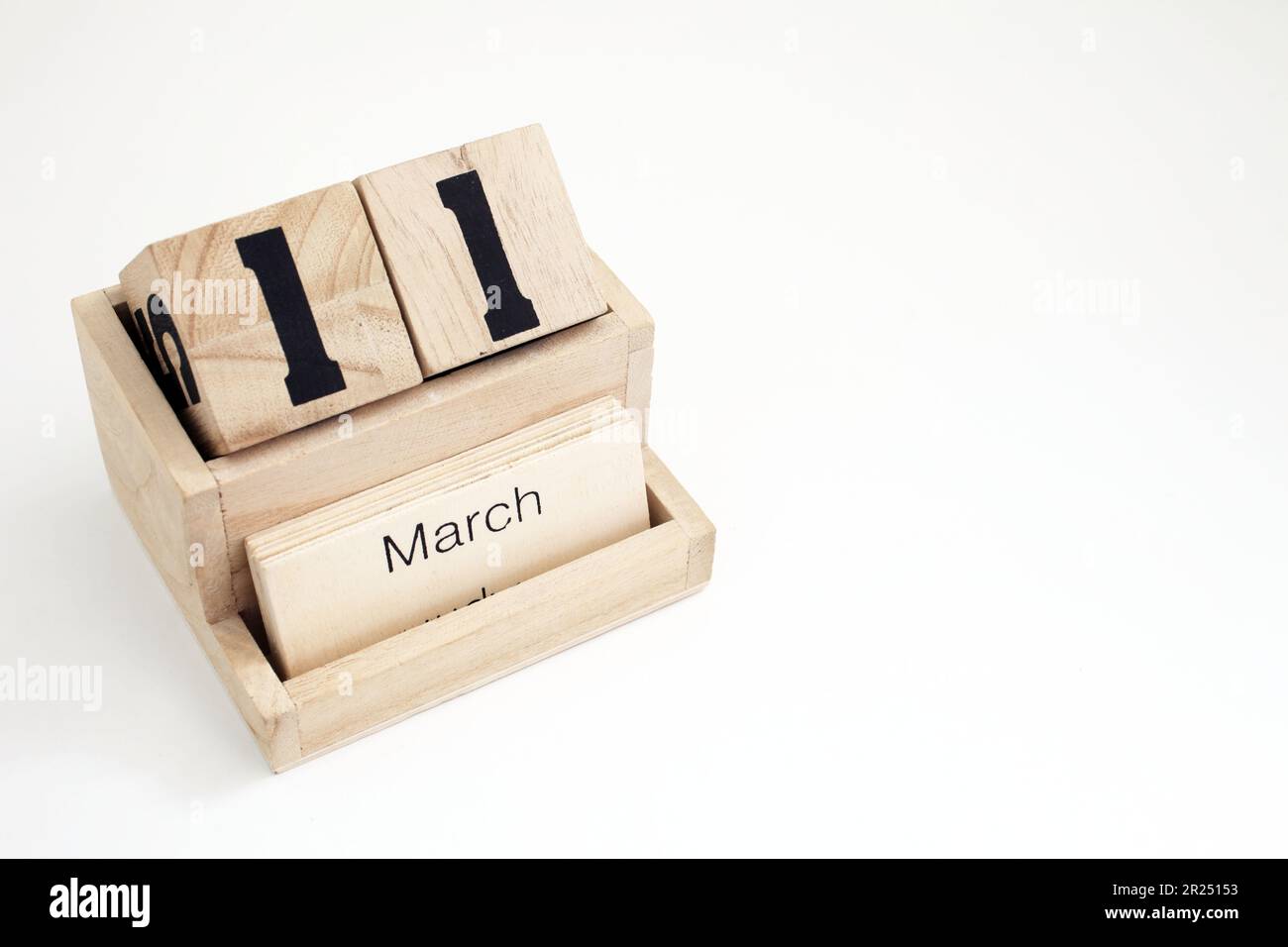 Wooden perpetual calendar showing the 11th of March Stock Photo - Alamy