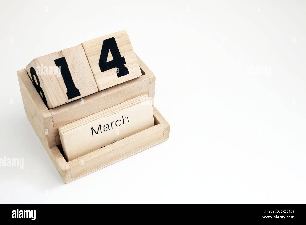 Wooden perpetual calendar showing the 14th of March Stock Photo - Alamy