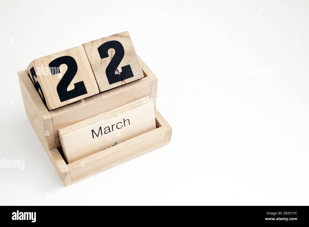 Wooden perpetual calendar showing the 22nd of March Stock Photo - Alamy