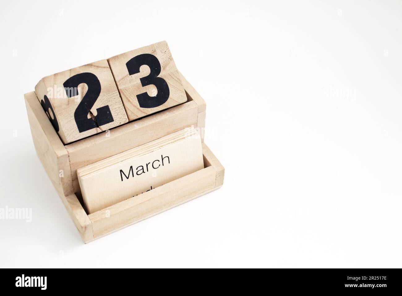 Wooden perpetual calendar showing the 23rd of March Stock Photo - Alamy