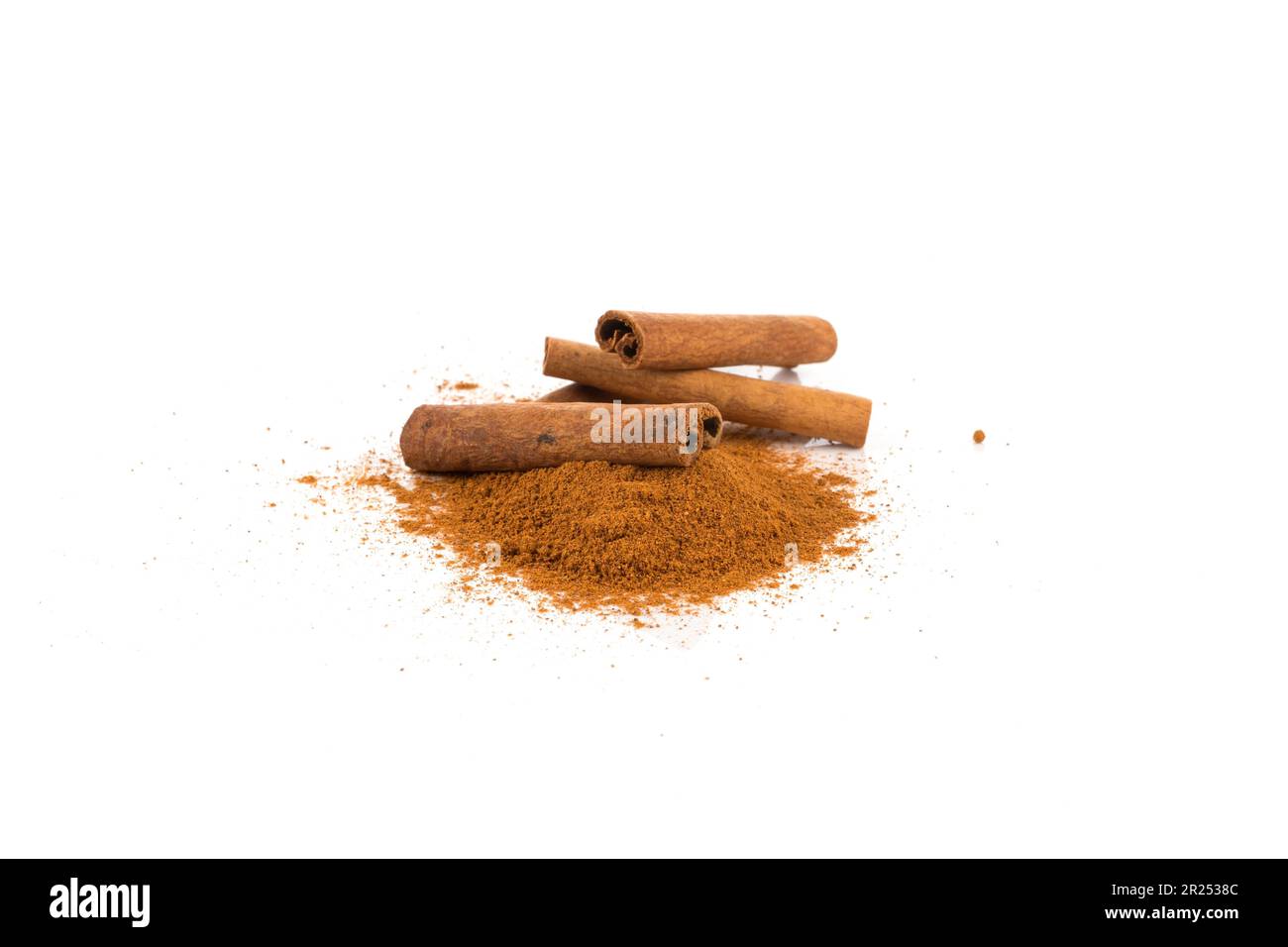 cinnamon powder isolated on a white background Stock Photo - Alamy