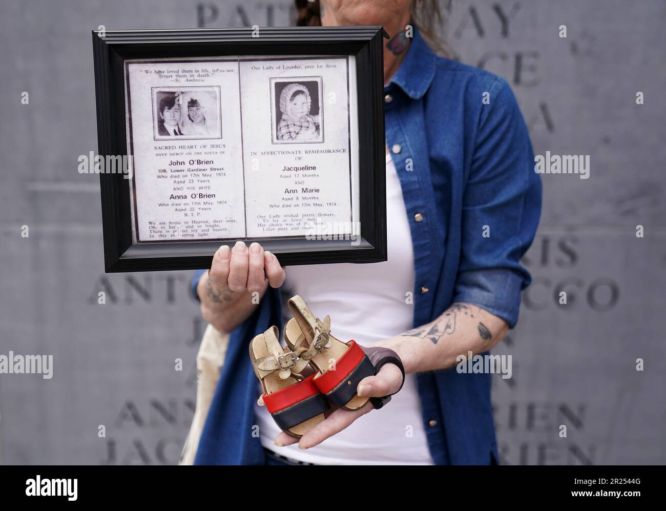 Cathy Ellis holds a pair of shoes which belonged to her niece 17-month ...