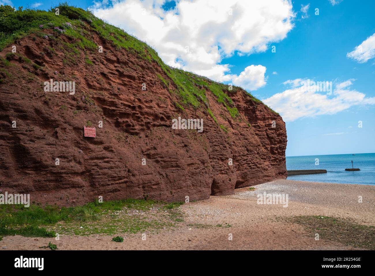 Red Rocks covered in greenery in Dawlish Warren, Devon, Uk Stock Photo ...