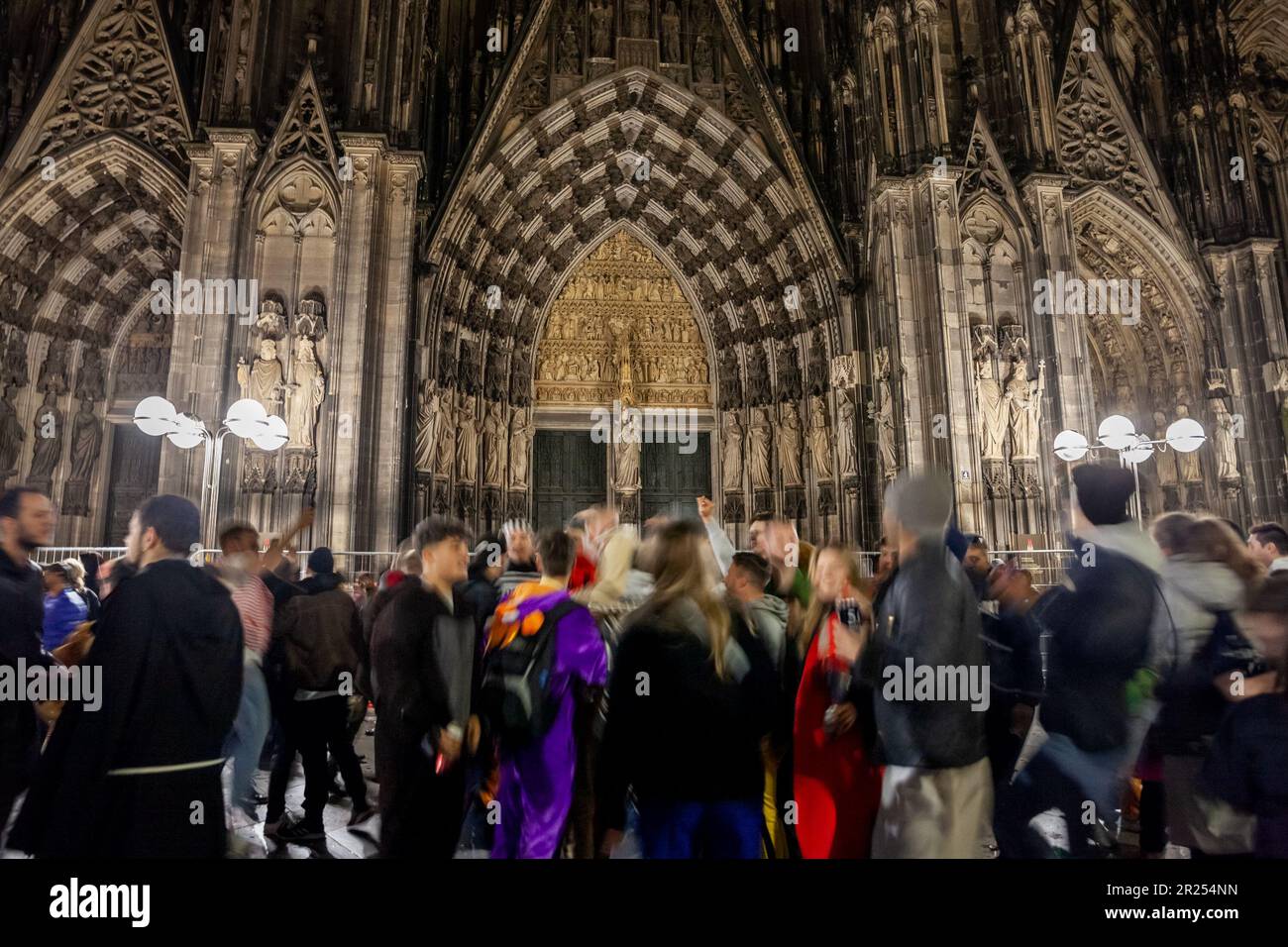 Picture of the entrance ot the cologne cathedral with people dancing in ...
