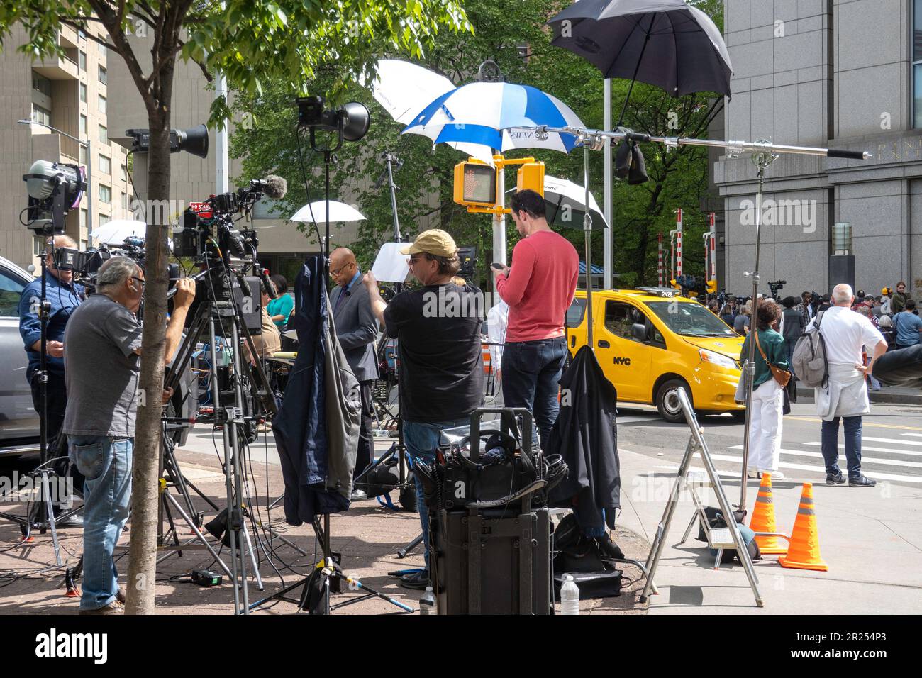 Media and spectators gather outside a New York State Court awaiting the ...