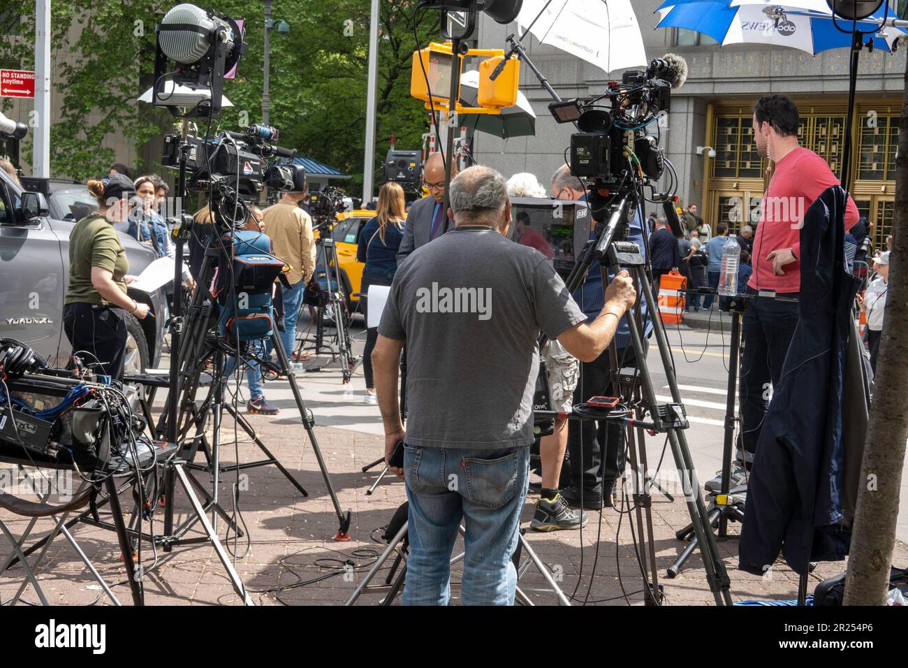 Media and spectators gather outside a New York State Court awaiting the ...