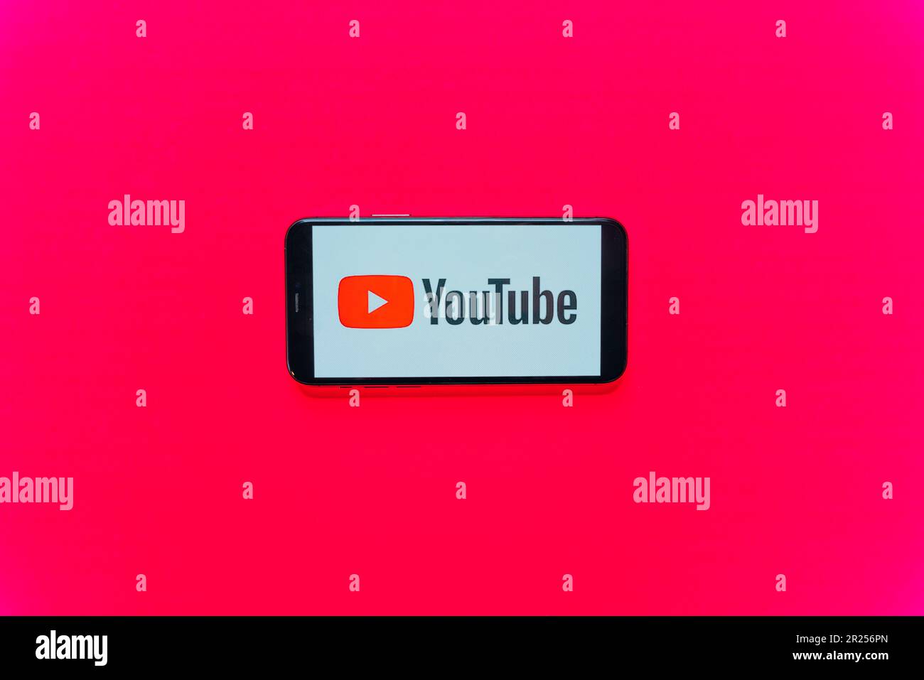 phone screen with youtube logo in pink background. Calgary, Canada ...