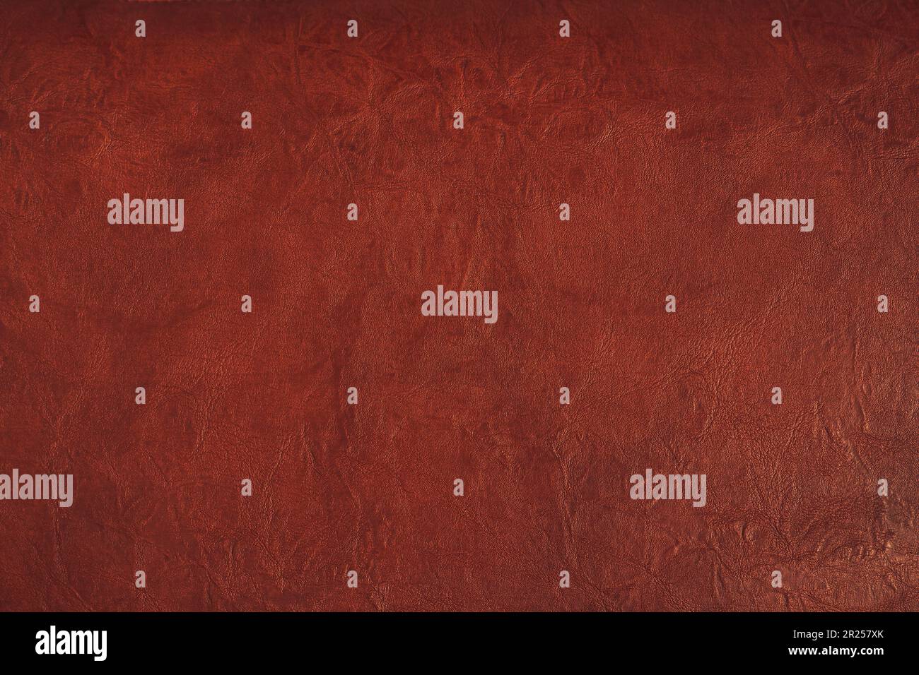 The texture of the red shade of the synthetic leather background ...