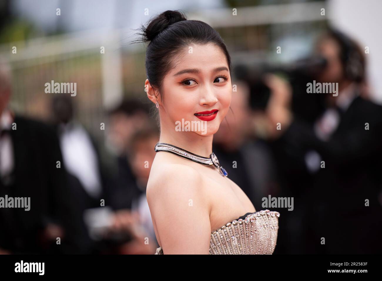 Guan Xiaotong poses for photographers upon arrival at the opening ...