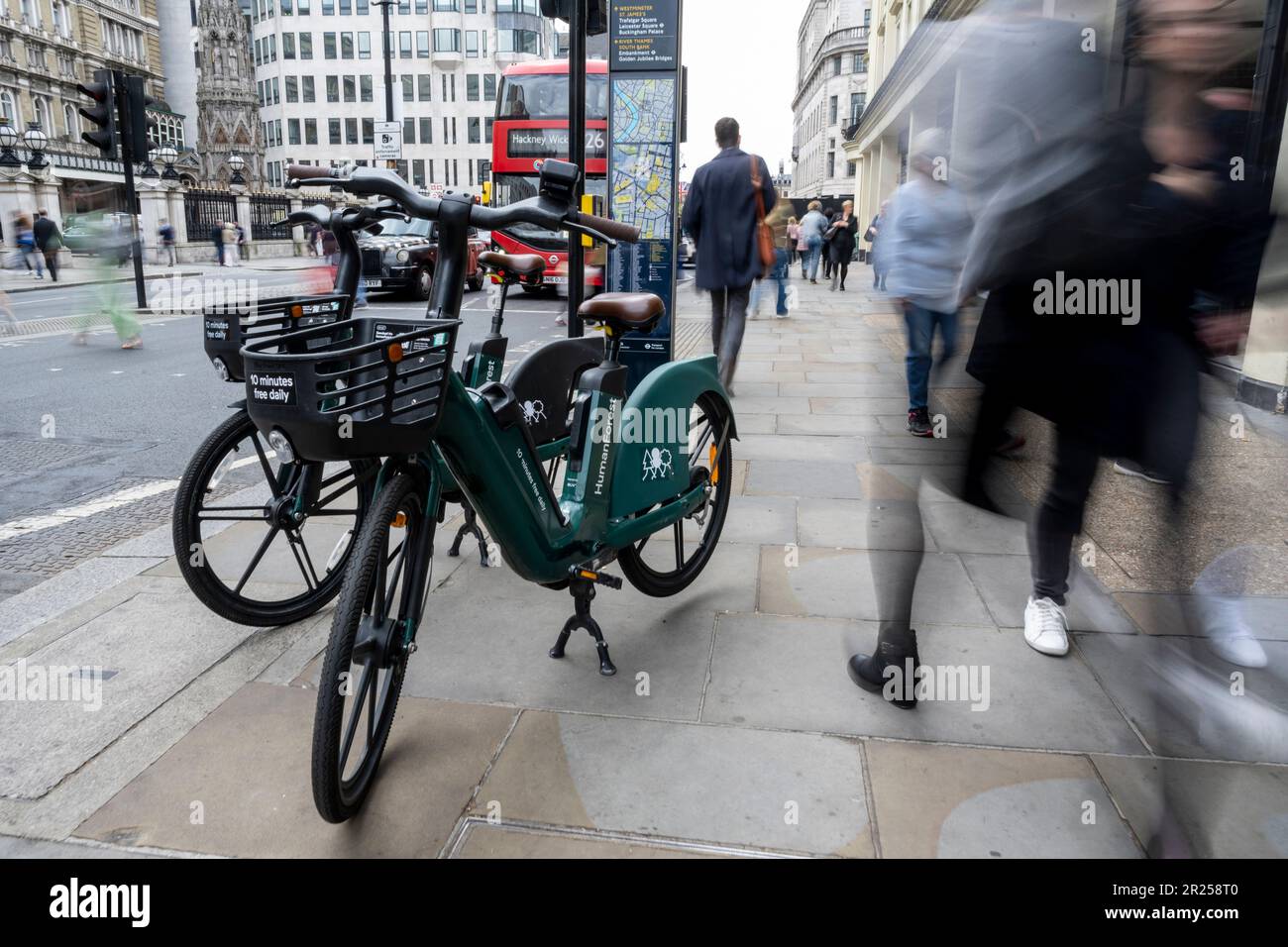 London, UK. 17 May 2023. The public passes electric hire cycles on a ...