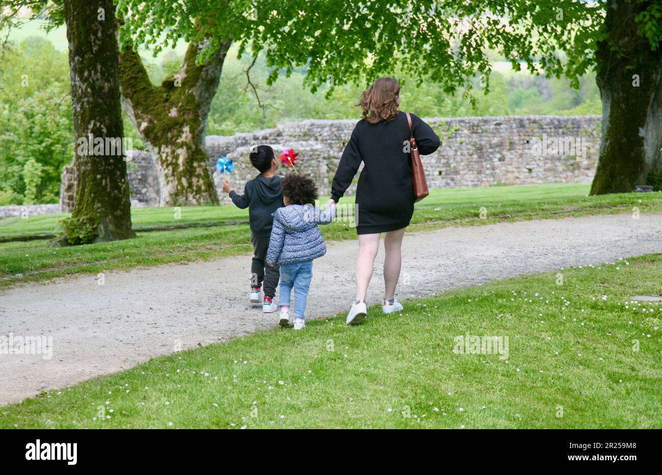 A young family enjoying their stroll in the grounds of the chateau ...