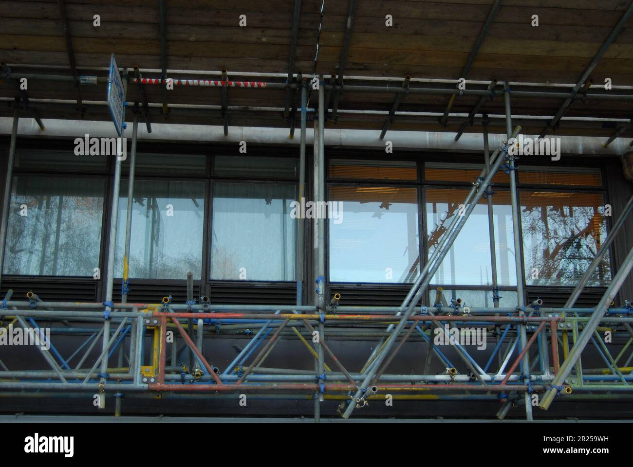 Window side of building with scaffolding under construction Stock Photo ...