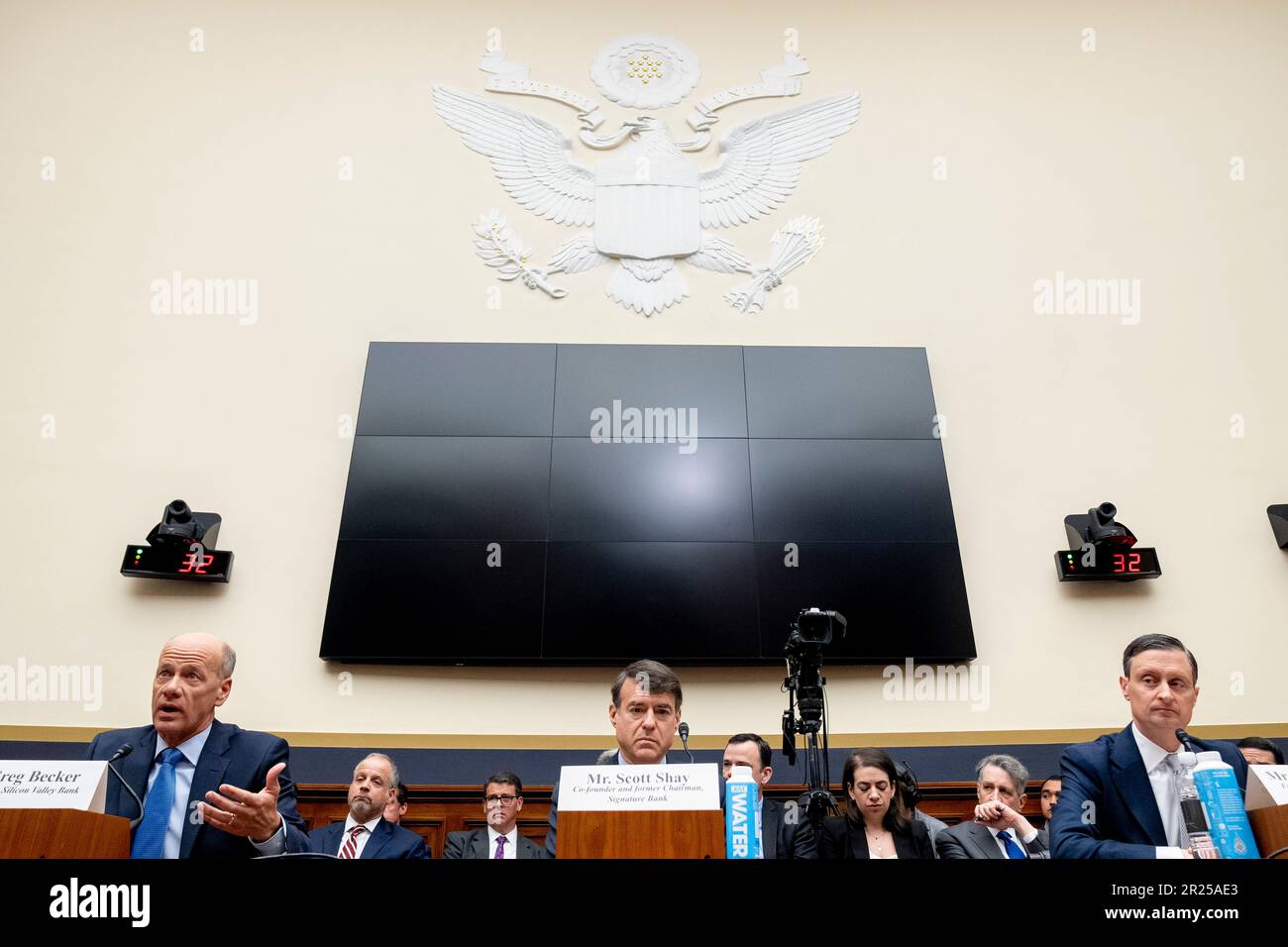 Former Silicon Valley Bank CEO Greg Becker, left, accompanied by ...